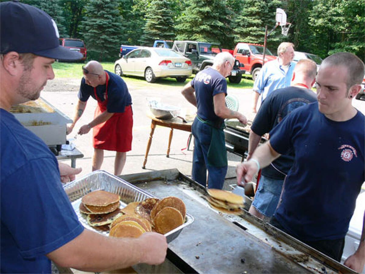 Plenty of pancakes on the griddle at firefighter breakfast