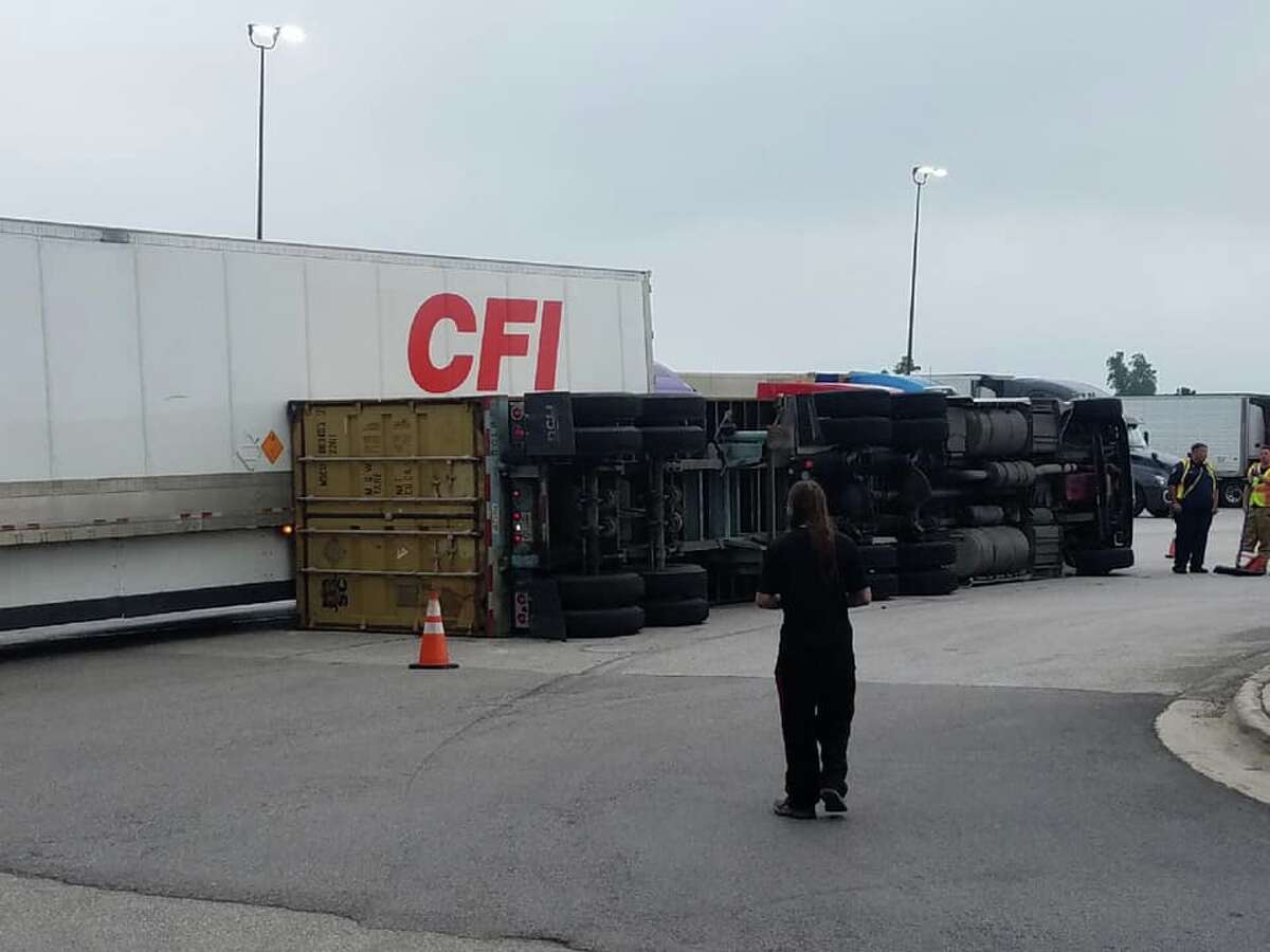 Tractor-trailer rolls over in Willis, leaving its 18 wheels off ground