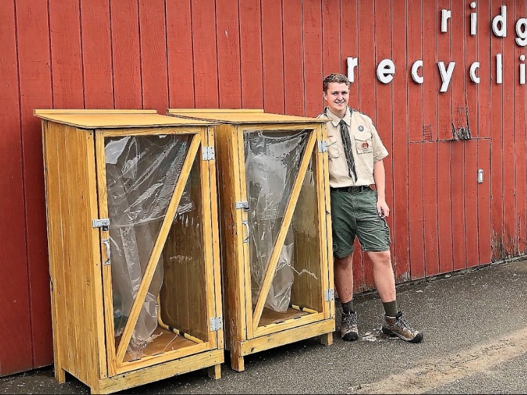 Boy Scout builds recycling bins