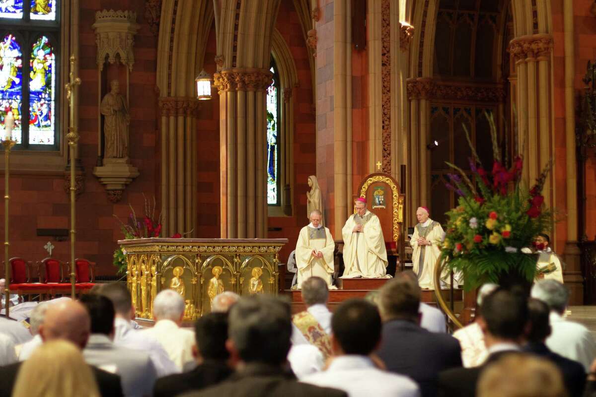 Three join priesthood in Albany ceremony