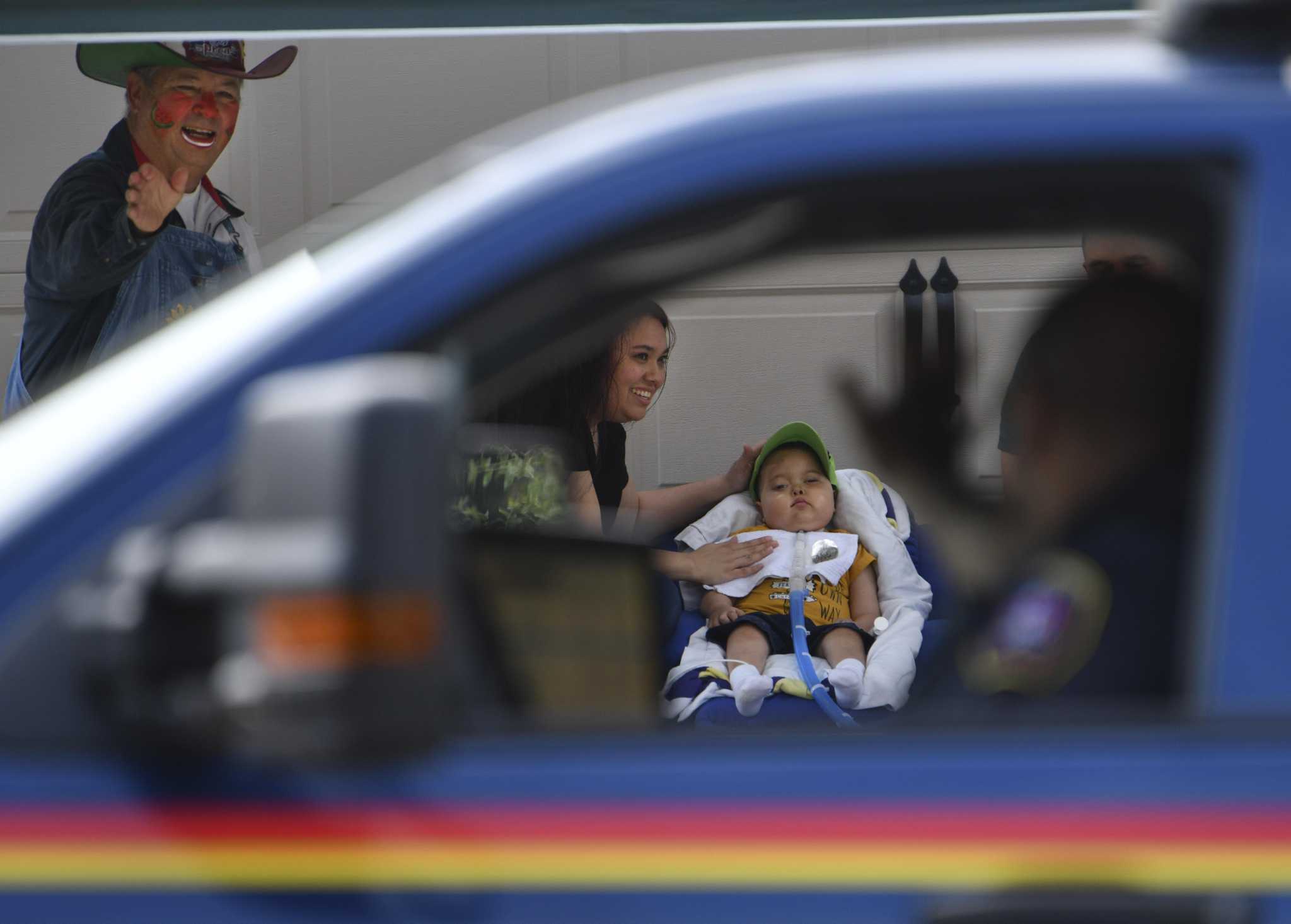 Boy battling cancer gets unique parade to lift his spirits