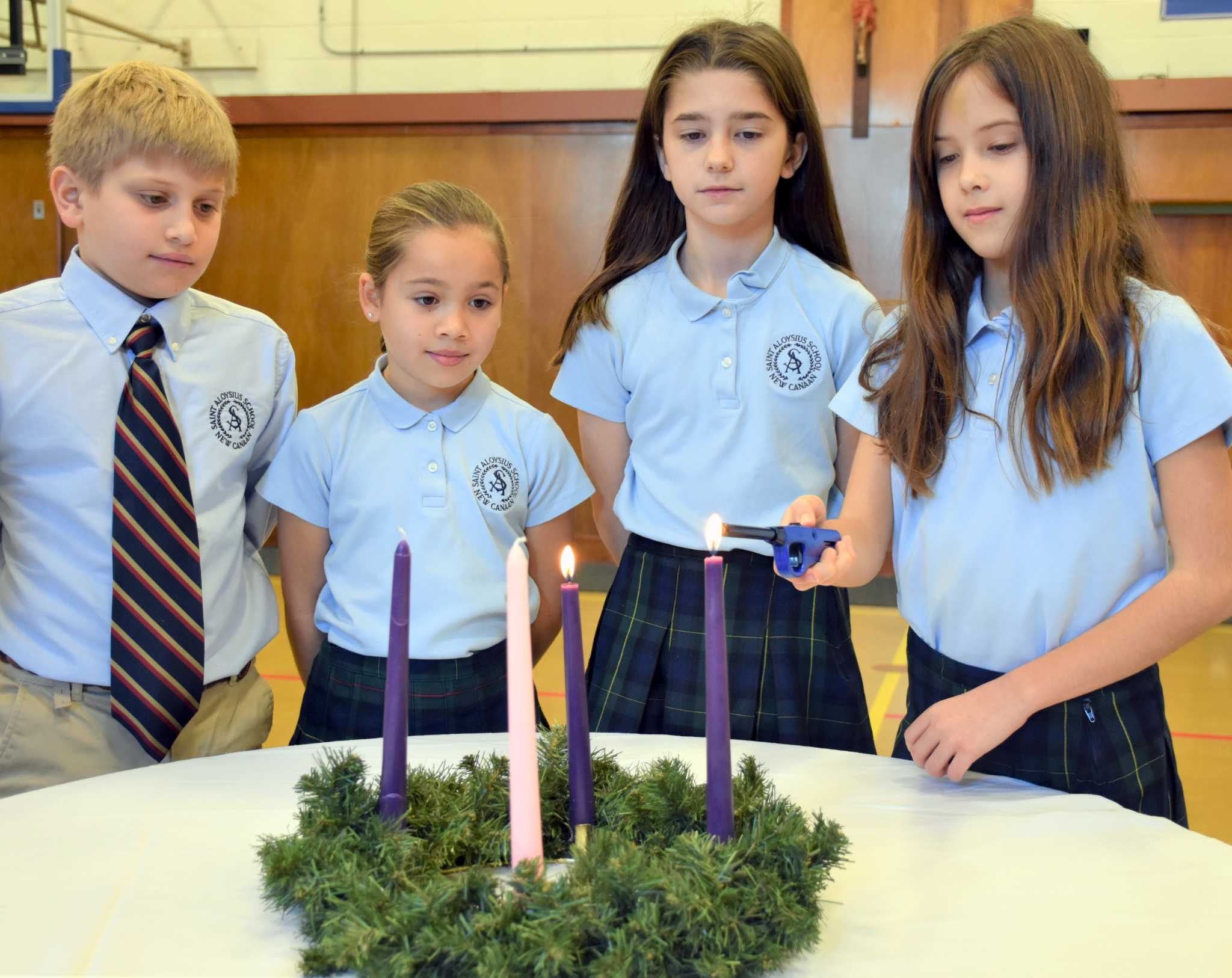 St. A’s students light Advent candle