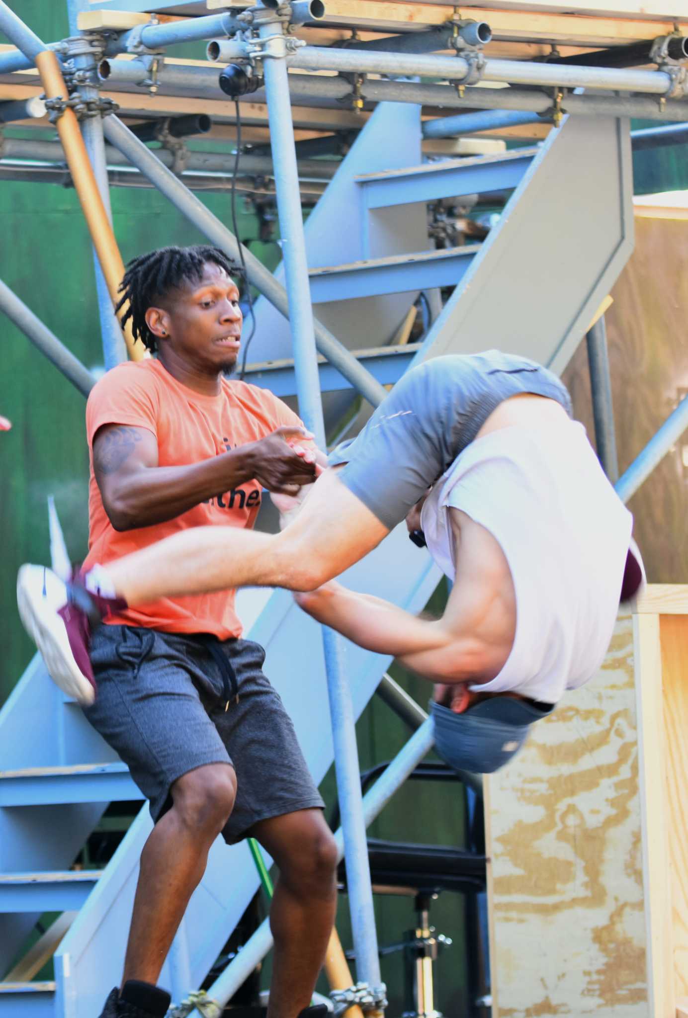 In the heat, performing artists sweat it up outdoors