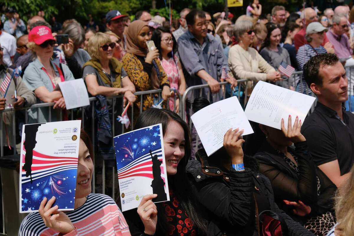 A theme as 500 become US citizens at Seattle Center: Immigrants make ...