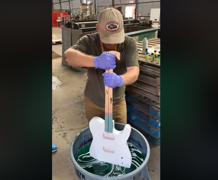 Video shows mesmerizing guitar-dyeing process at workshop in Houston
