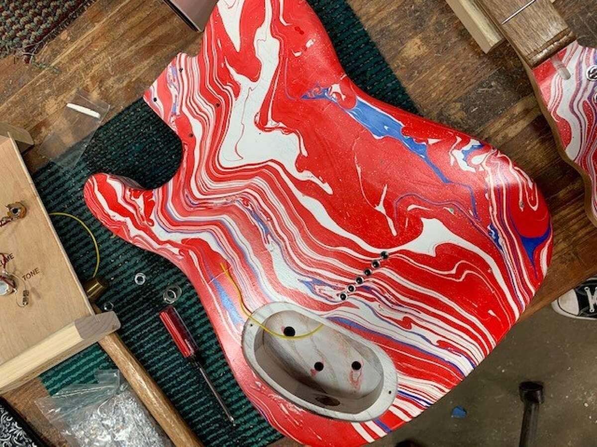Video shows mesmerizing guitar-dyeing process at workshop in Houston