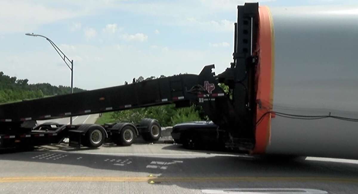 18-wheeler partially hanging off bridge on Highway 59 in Montgomery County