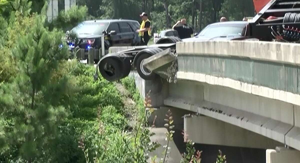 18-wheeler partially hanging off bridge on Highway 59 in Montgomery County