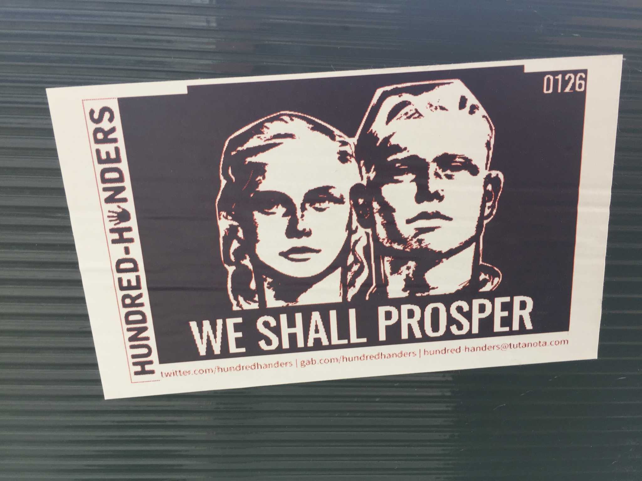 White supremacist stickers plastered around downtown Troy