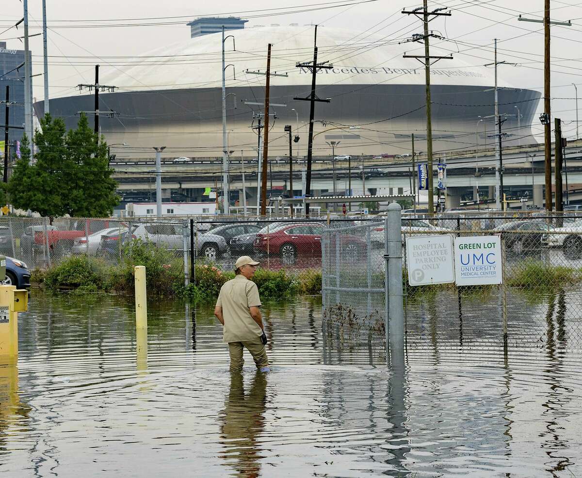 Photos show eerie scene as torrential rains flood New Orleans