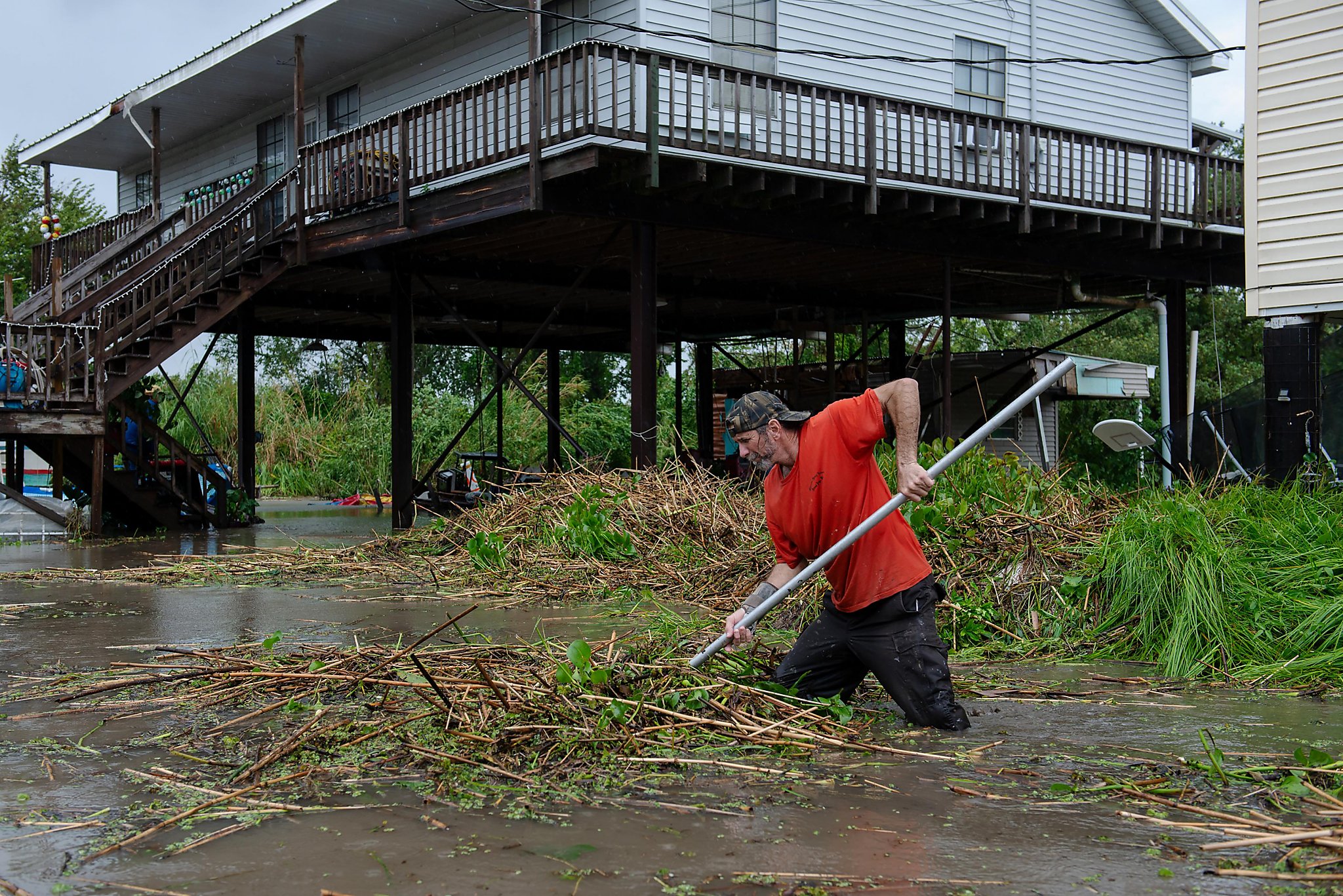 Barry’s flood threat lingers as storm slowly sweeps inland