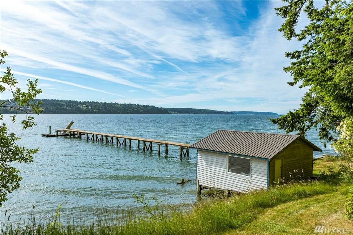 Enjoy a stunning, secluded 38 acres with this Freeland estate