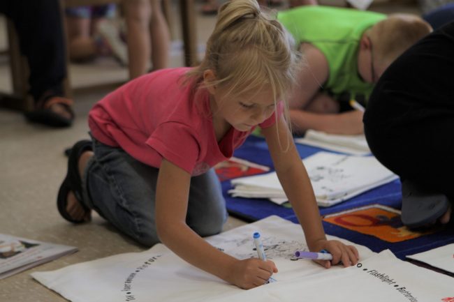 Red Cross members teach children about disaster planning