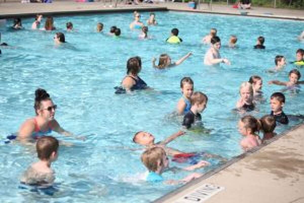 Community members enjoy swimming lessons