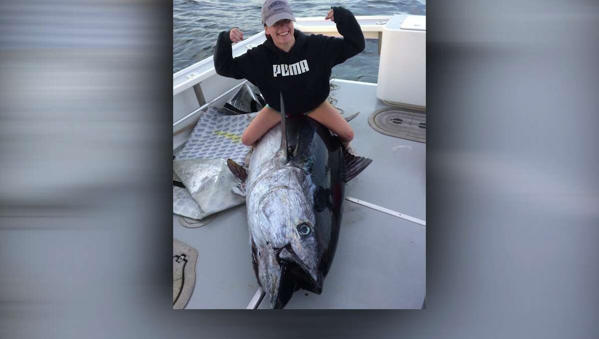 18-year-old reels in 700-pound tuna