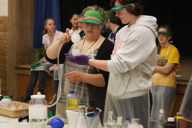 AP chemistry students present experiments for younger students