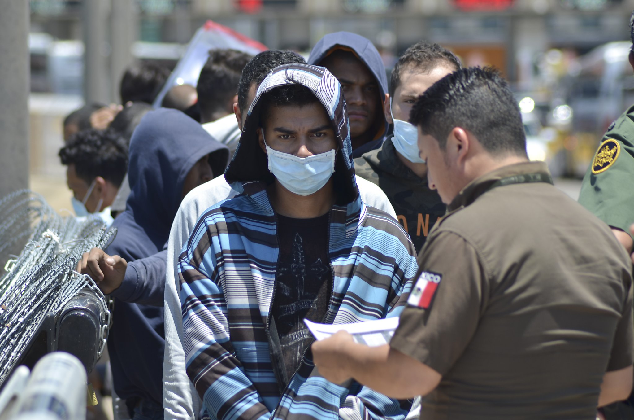 Over 500 migrants sent to Mexico via Laredo as part of 'Remain in ...