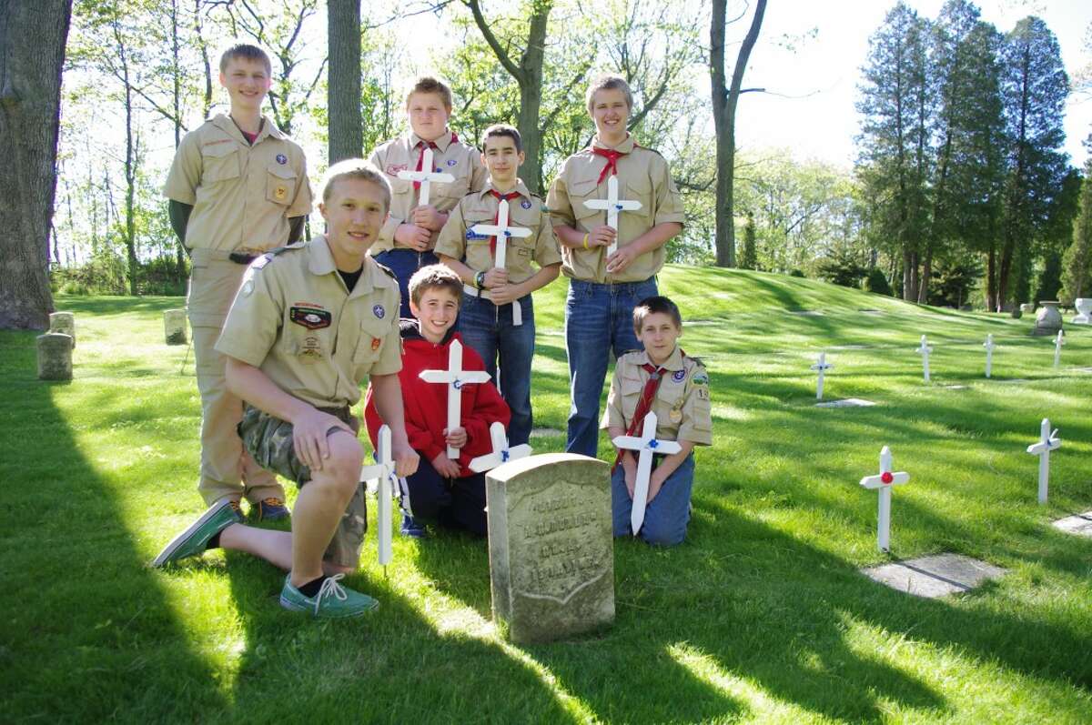 Scouts prepare cemetery for Memorial Day