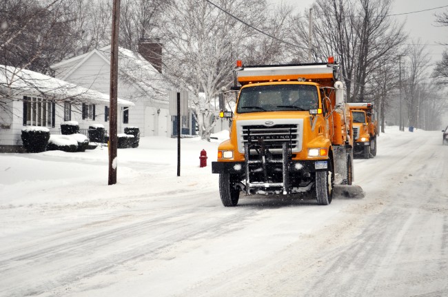 Road crews combatting snow fall