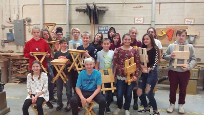 Onekama Middle School wood shop class create folding chairs