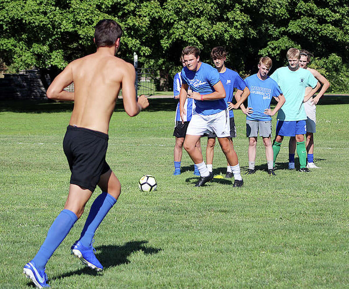 CHANGING SIDELINES: Gould takes reins as Marquette coach