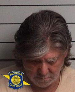 Manistee man charged after firing gun in residence