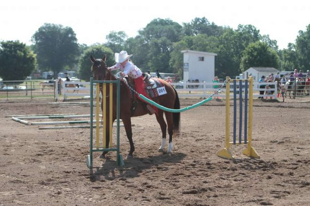 Competitors showcase skill during trail class horse show