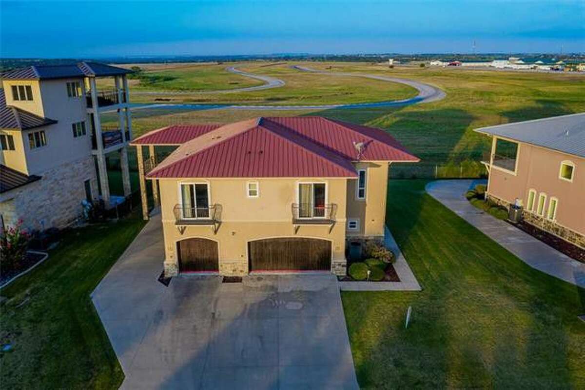 North Texas home has a race track for a backyard, and six-car garage ...
