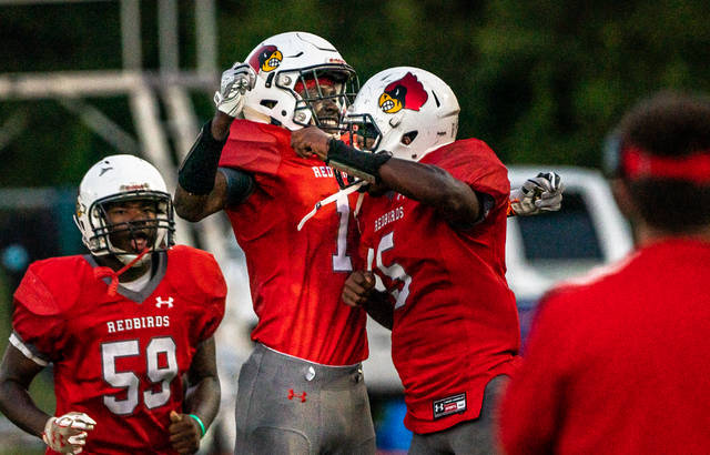 PREP FOOTBALL: Alton rallies past Quincy for first win