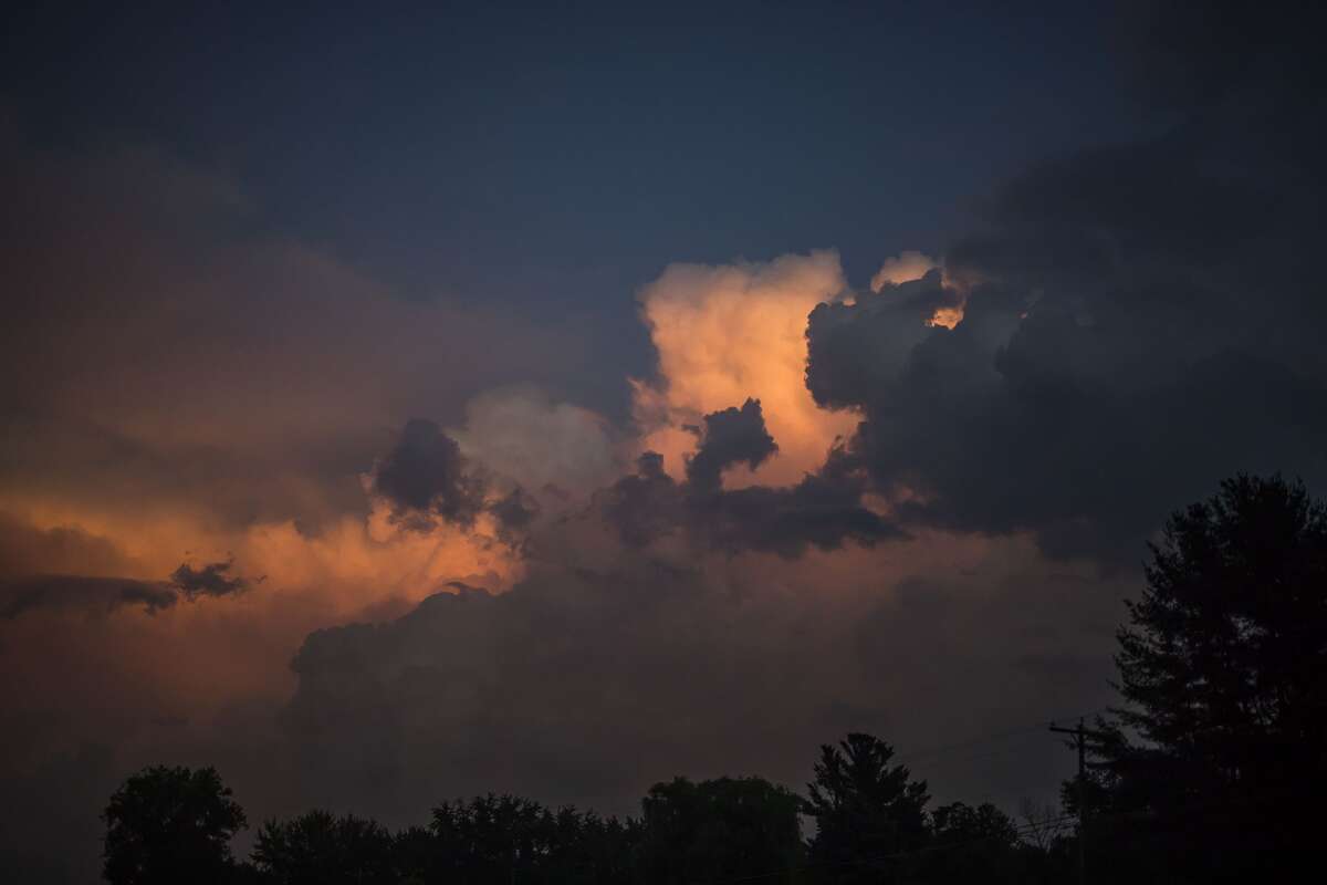 Volcanic ash dusts Houston skyline with purple haze