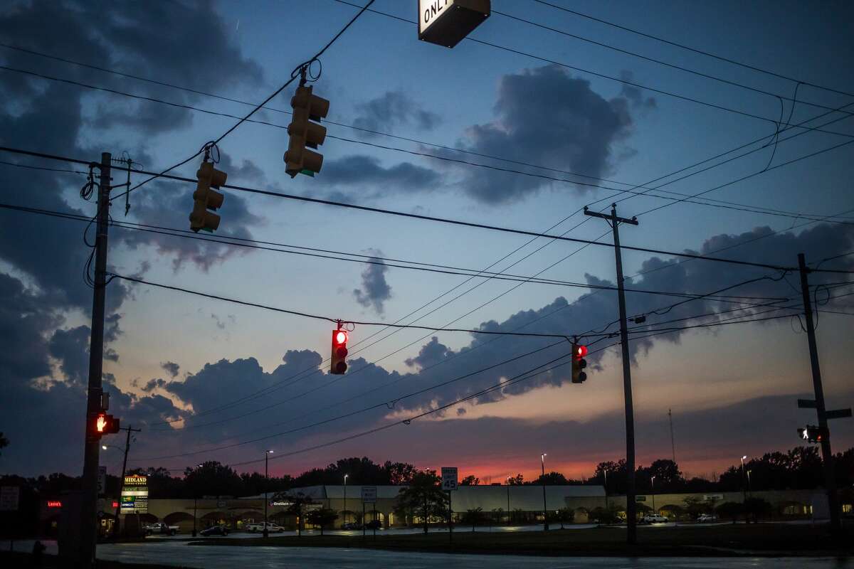 Volcanic ash dusts Houston skyline with purple haze