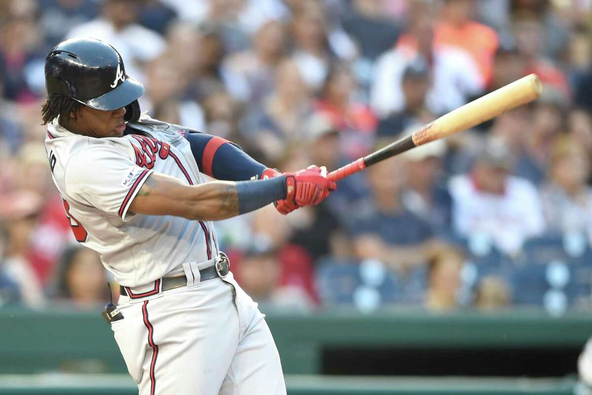 Acuna helps Braves lock up playoff spot
