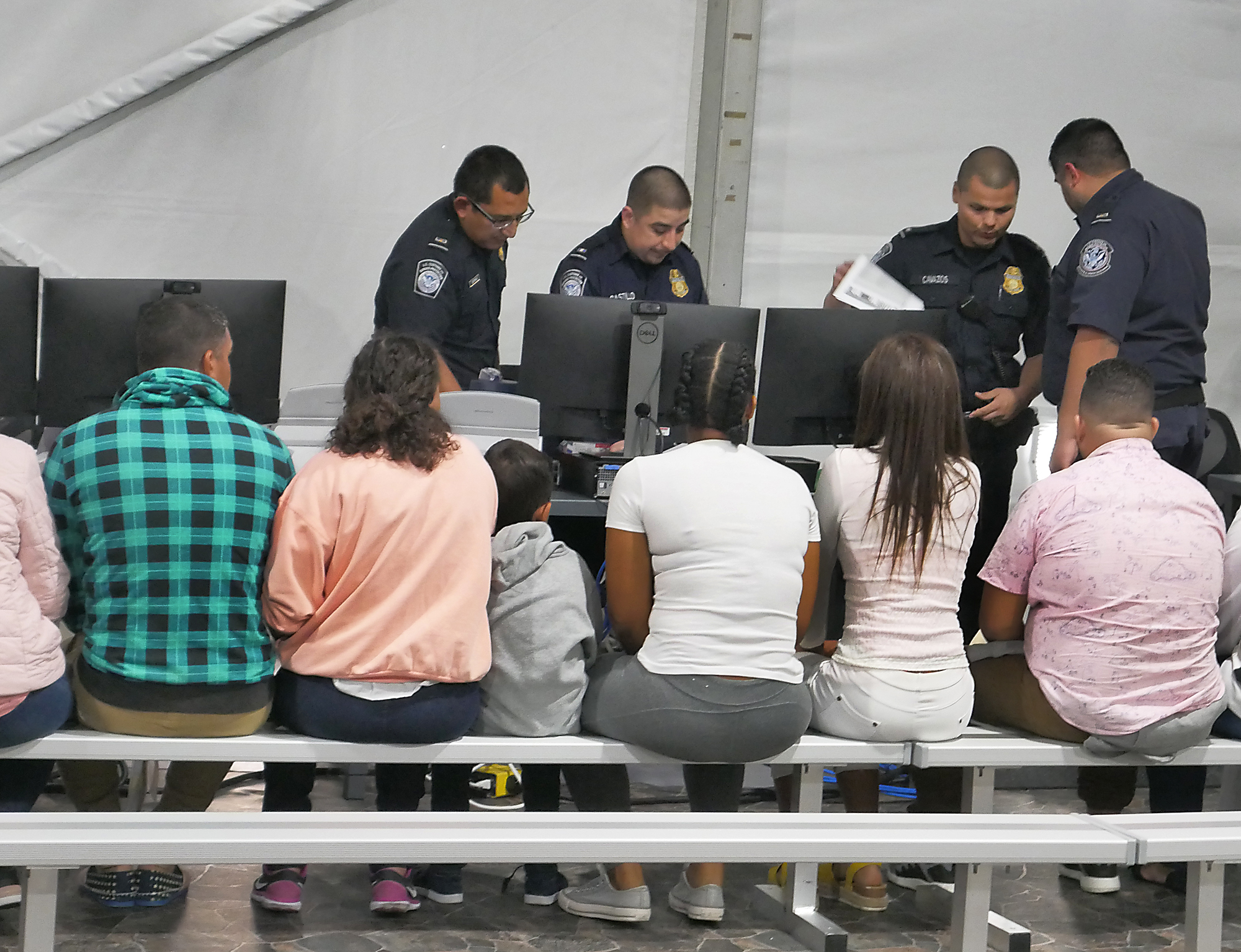 Migrants in fear, await fate as officials tour migrant facility in Laredo