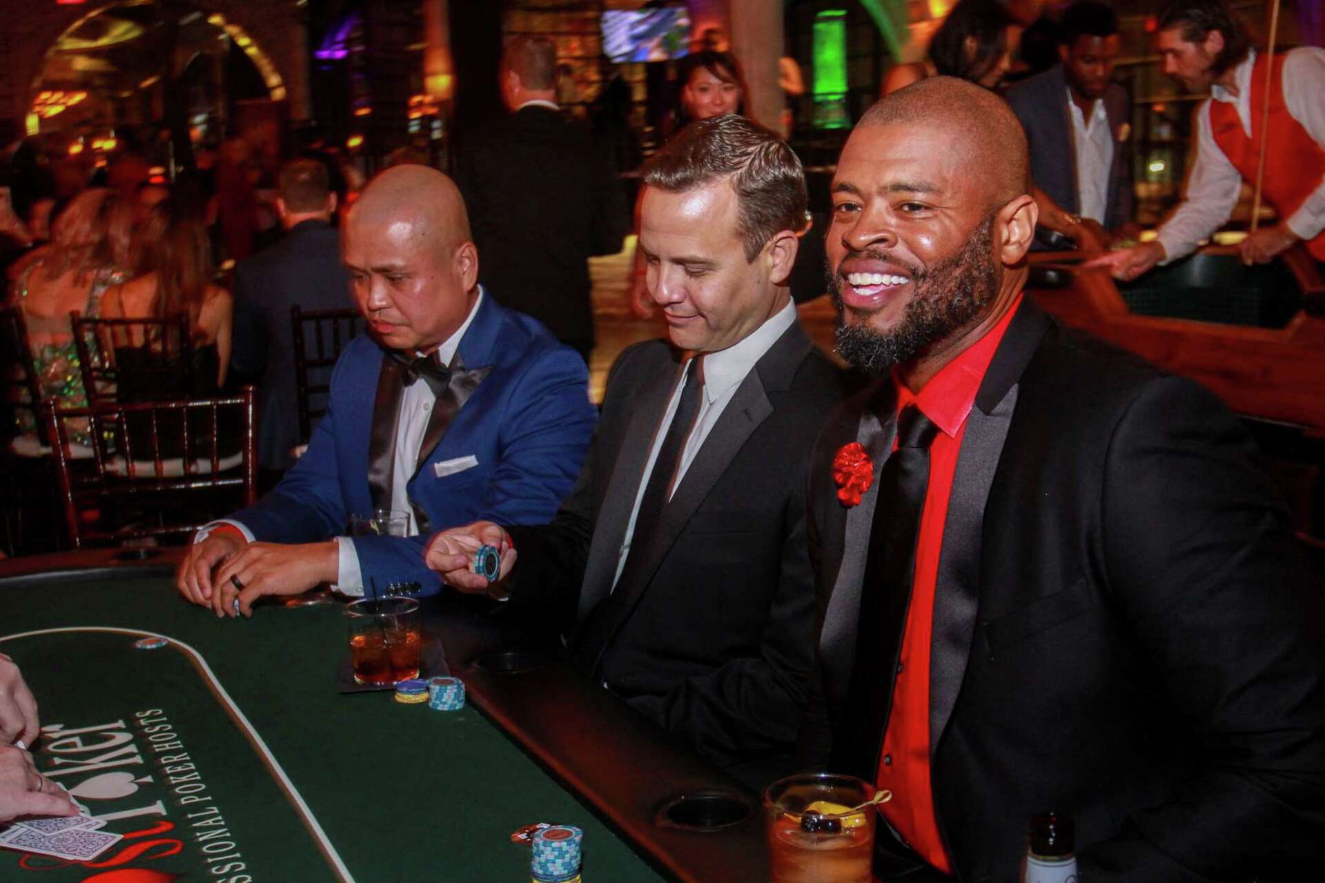 Former Texans stars channel their inner 007 for Wade Smith's annual ...