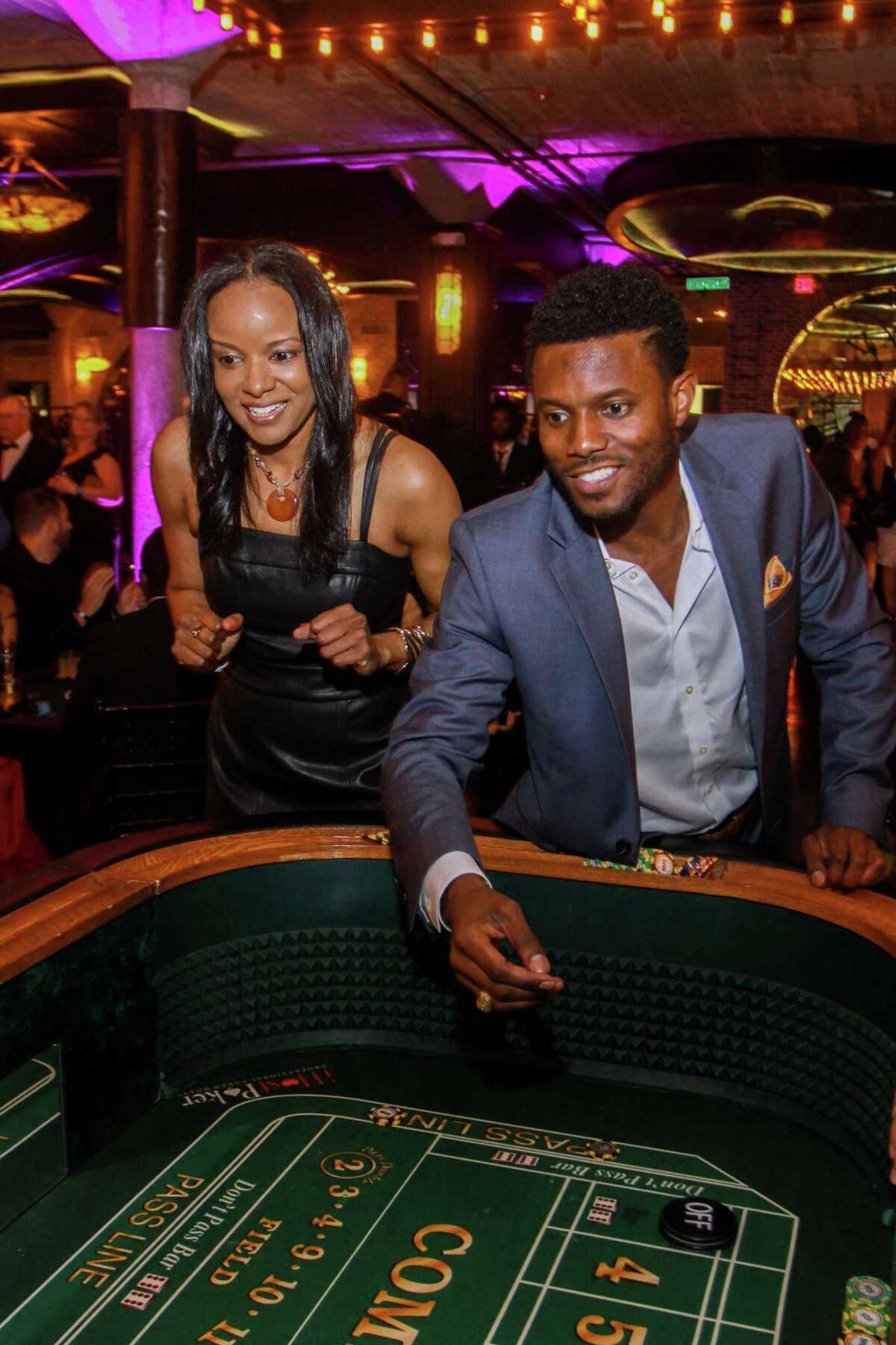 Former Texans stars channel their inner 007 for Wade Smith's annual celebrity poker tournament
