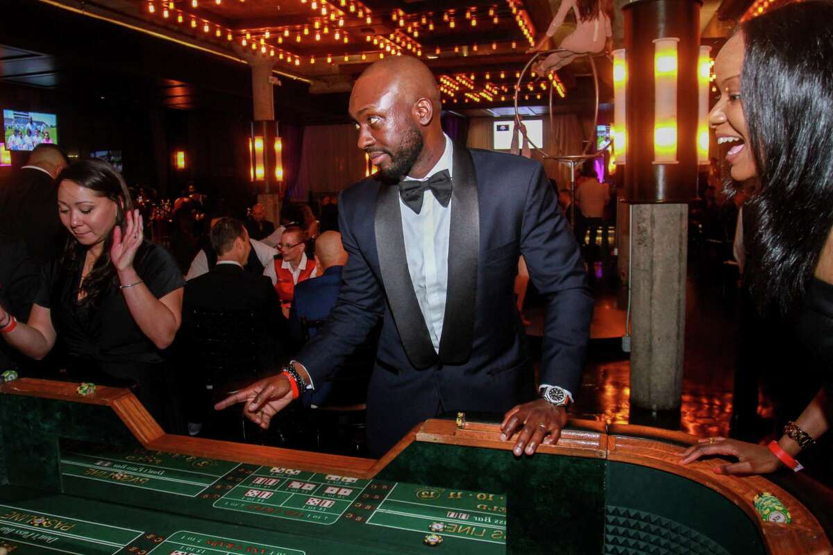 Former Texans stars channel their inner 007 for Wade Smith's annual ...