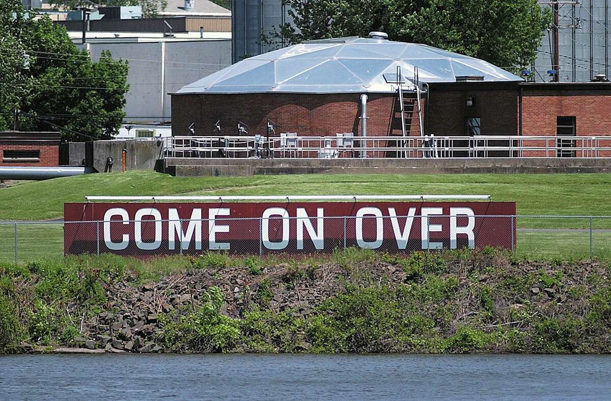 Portland’s ‘Come on Over’ sign emerges from the overgrowth