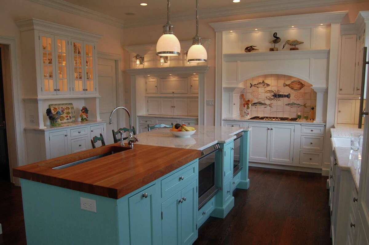 Colored cabinets are a bold choice and add character to a room
