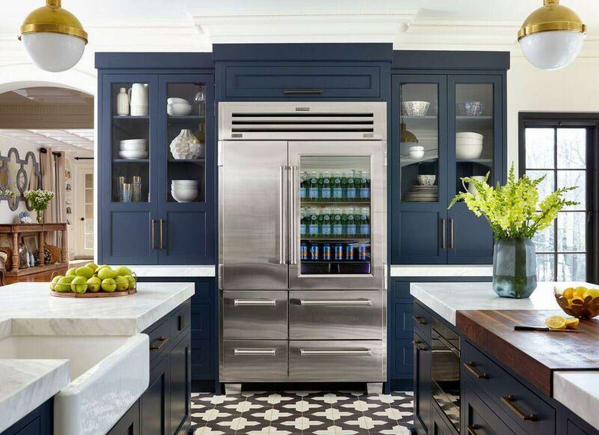 Colored cabinets are a bold choice and add character to a room
