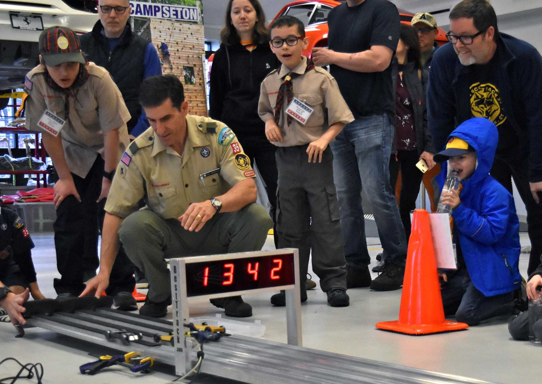 Adults to race Pinewood Derby cars at Miller Motorcars in Greenwich