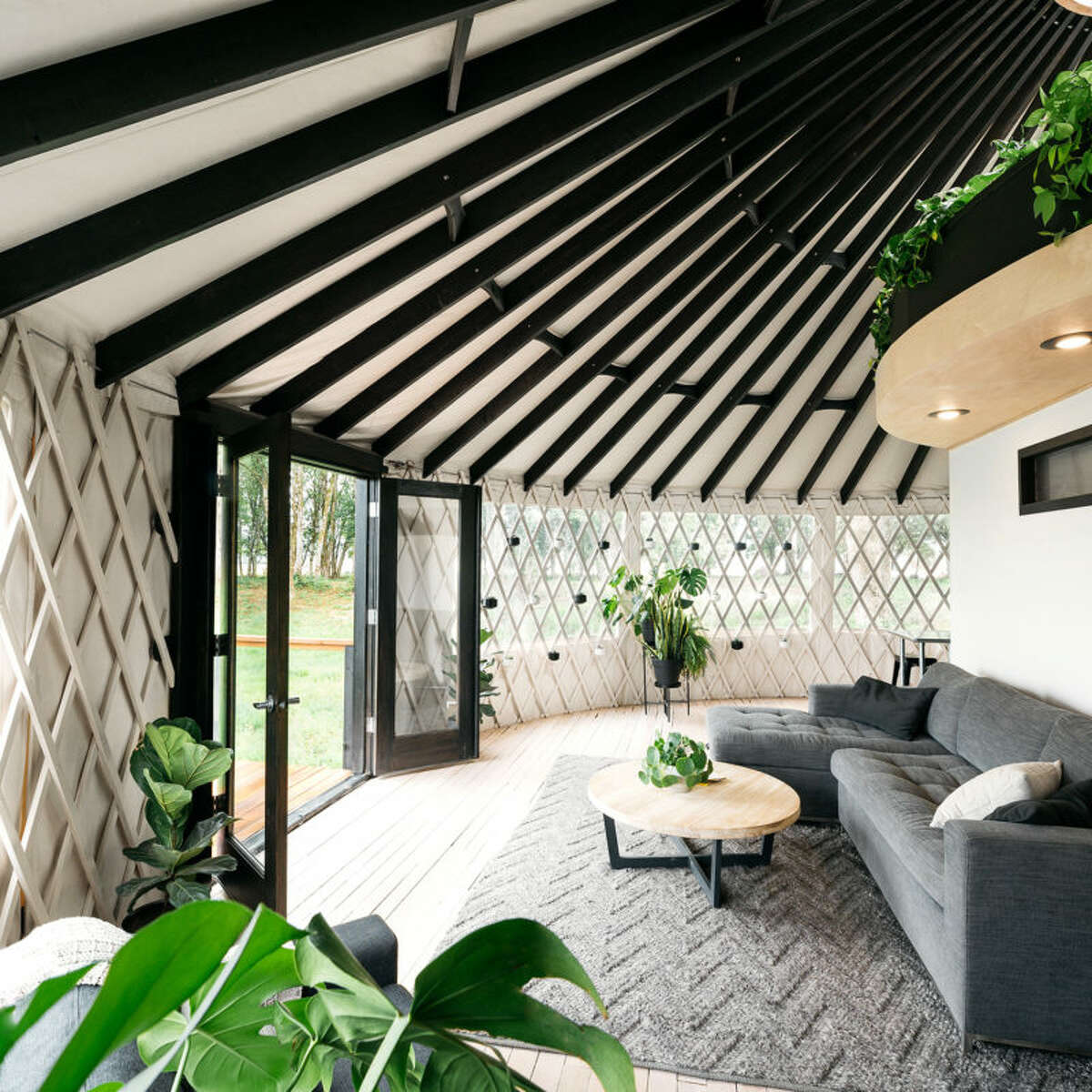You’ll want to move into this modern, foliage-filled yurt