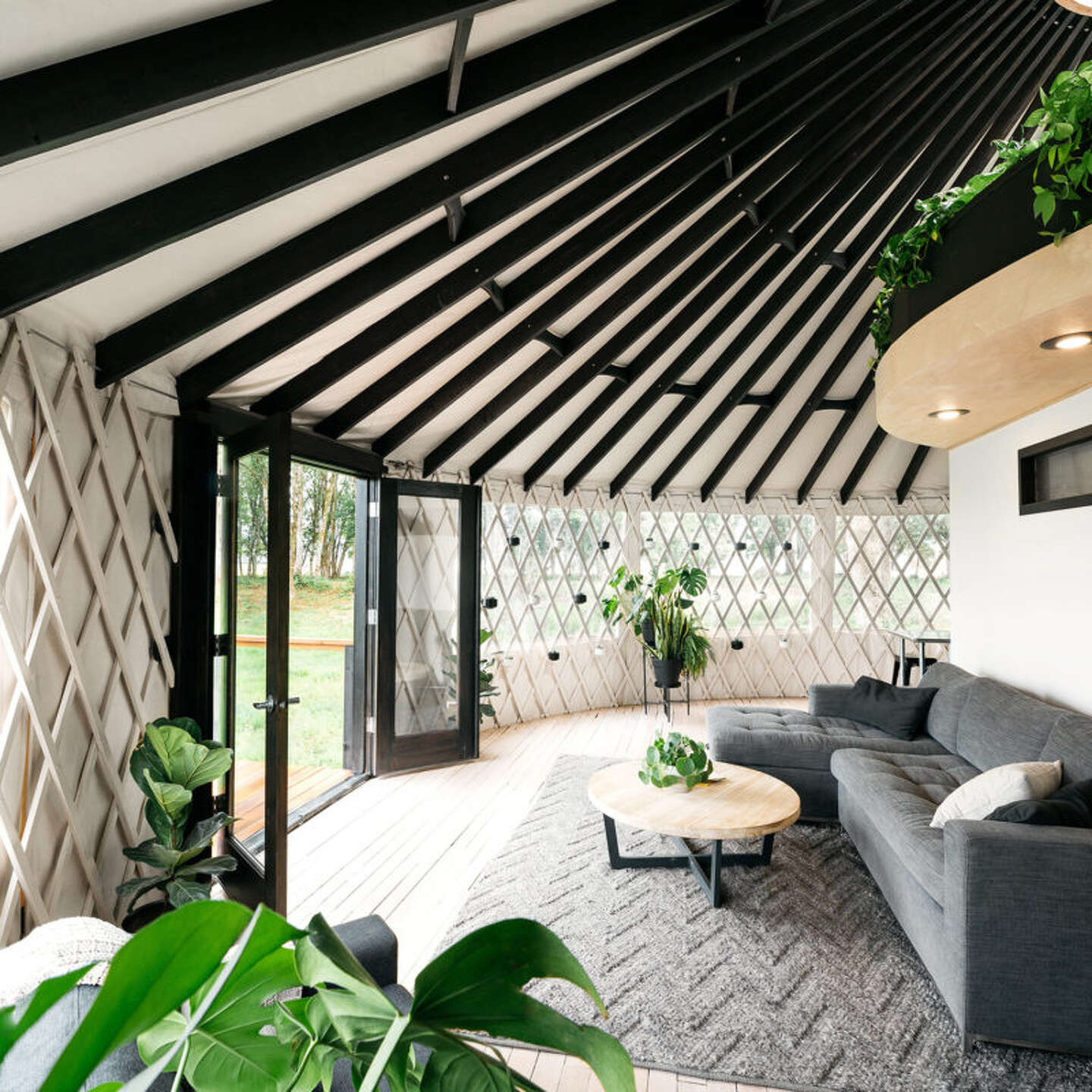 You’ll want to move into this modern, foliage-filled yurt