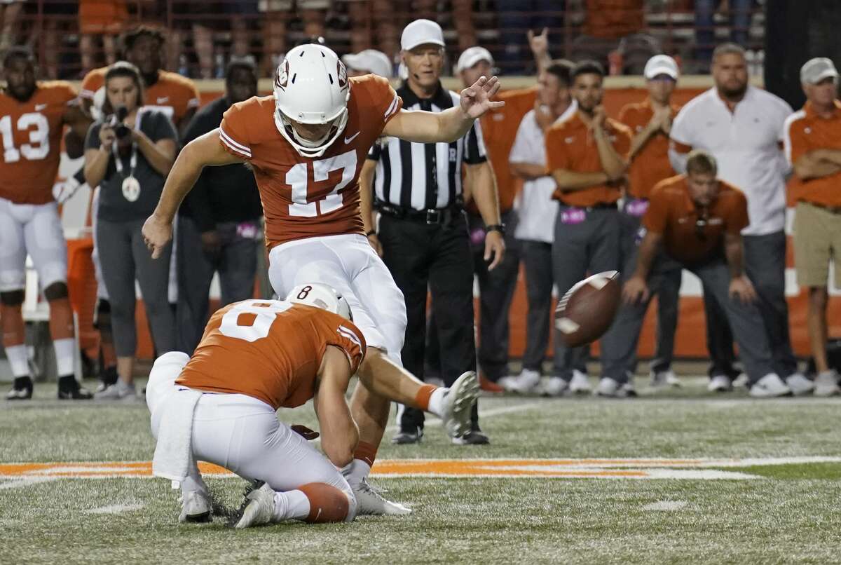 Texas hangs on for win over Kansas in high-scoring shootout