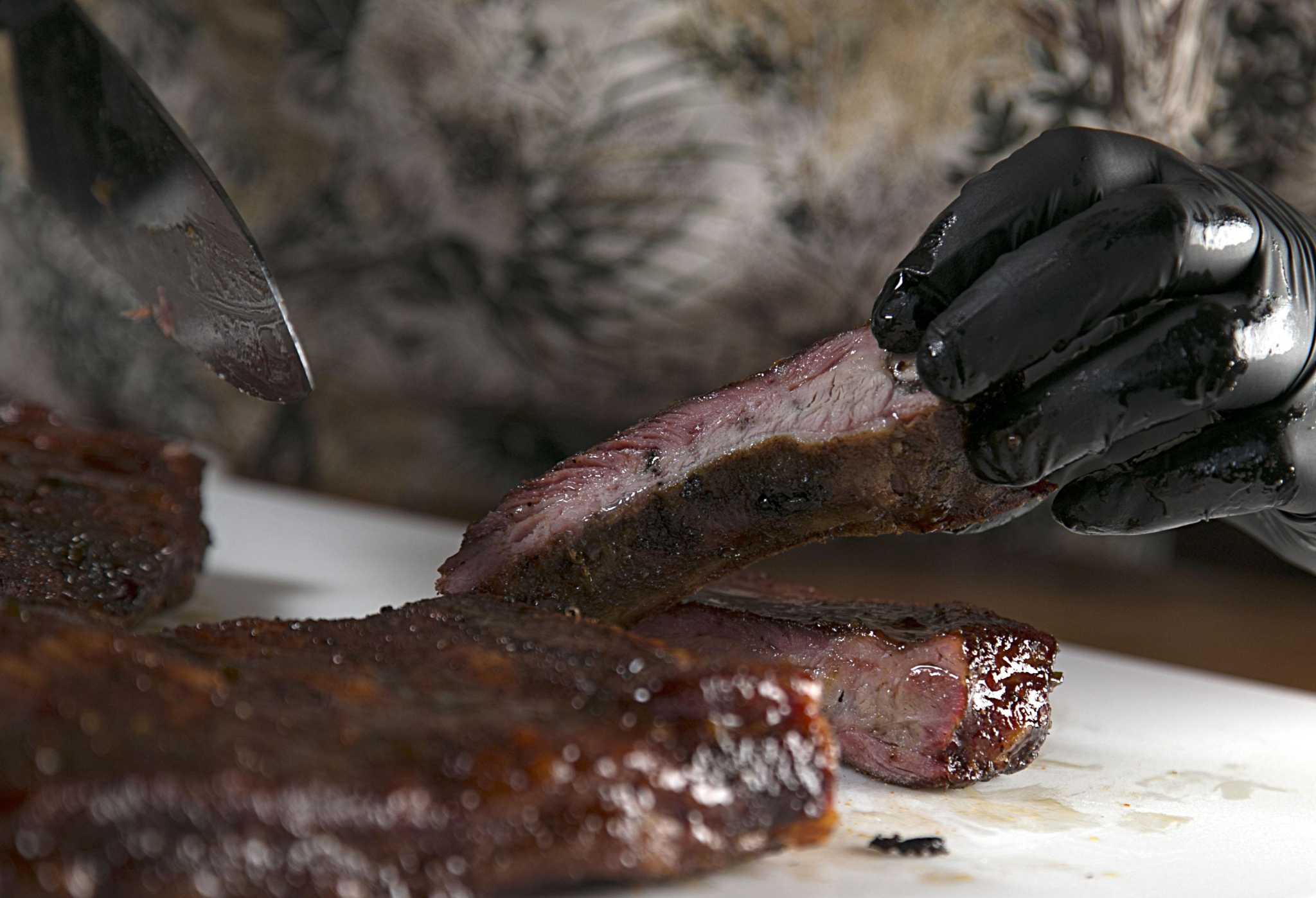 Neon, whole hog shine at top Houston barbecue's second dance