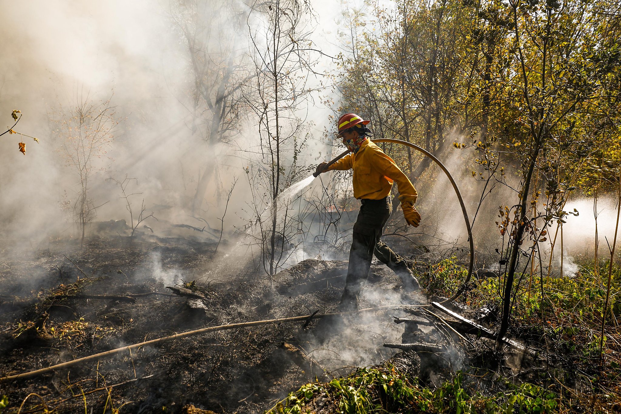 Kincade Fire is fully contained, but firefighters are sticking around