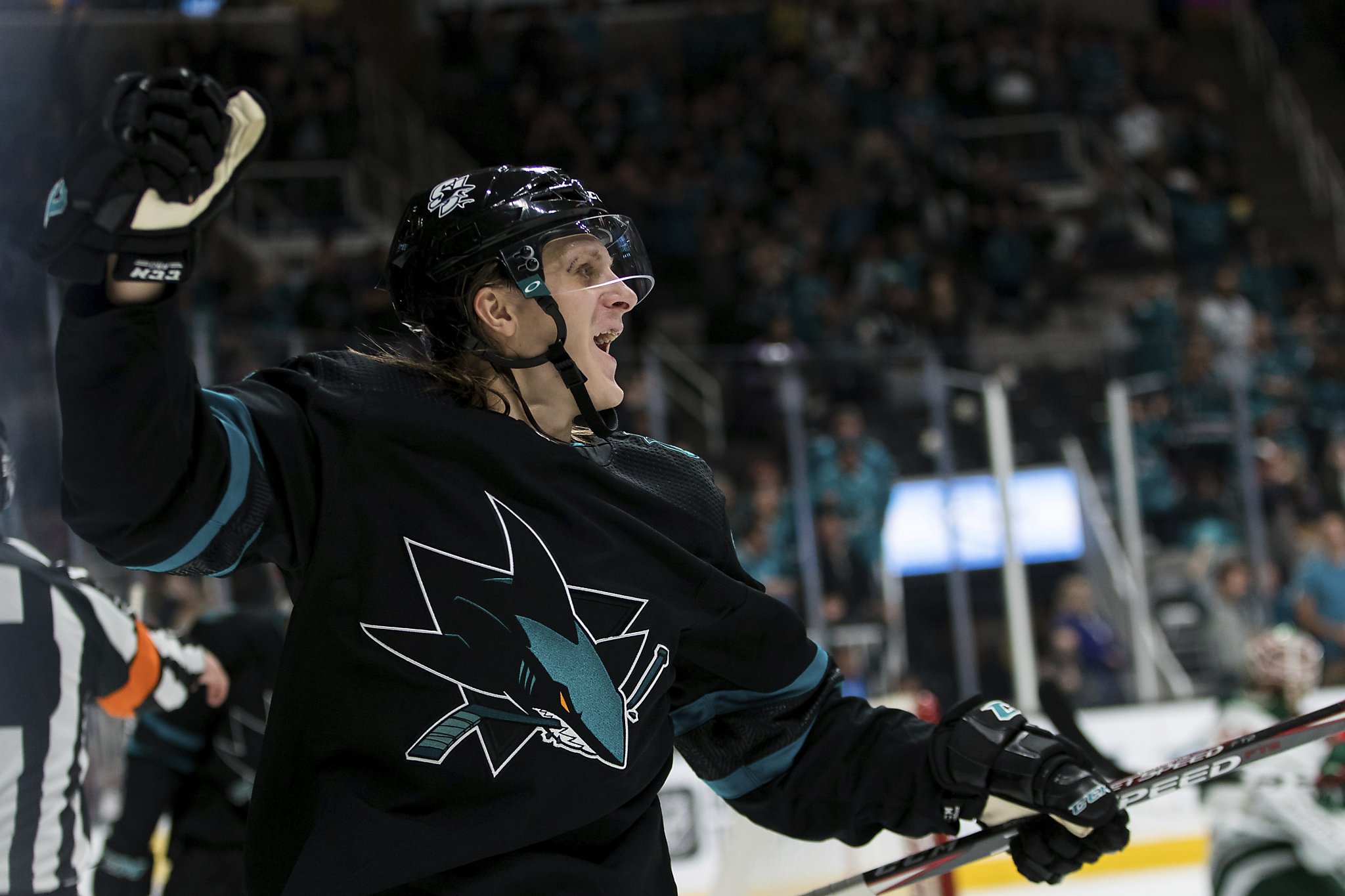 Sharks score first four goals, then hold off Wild