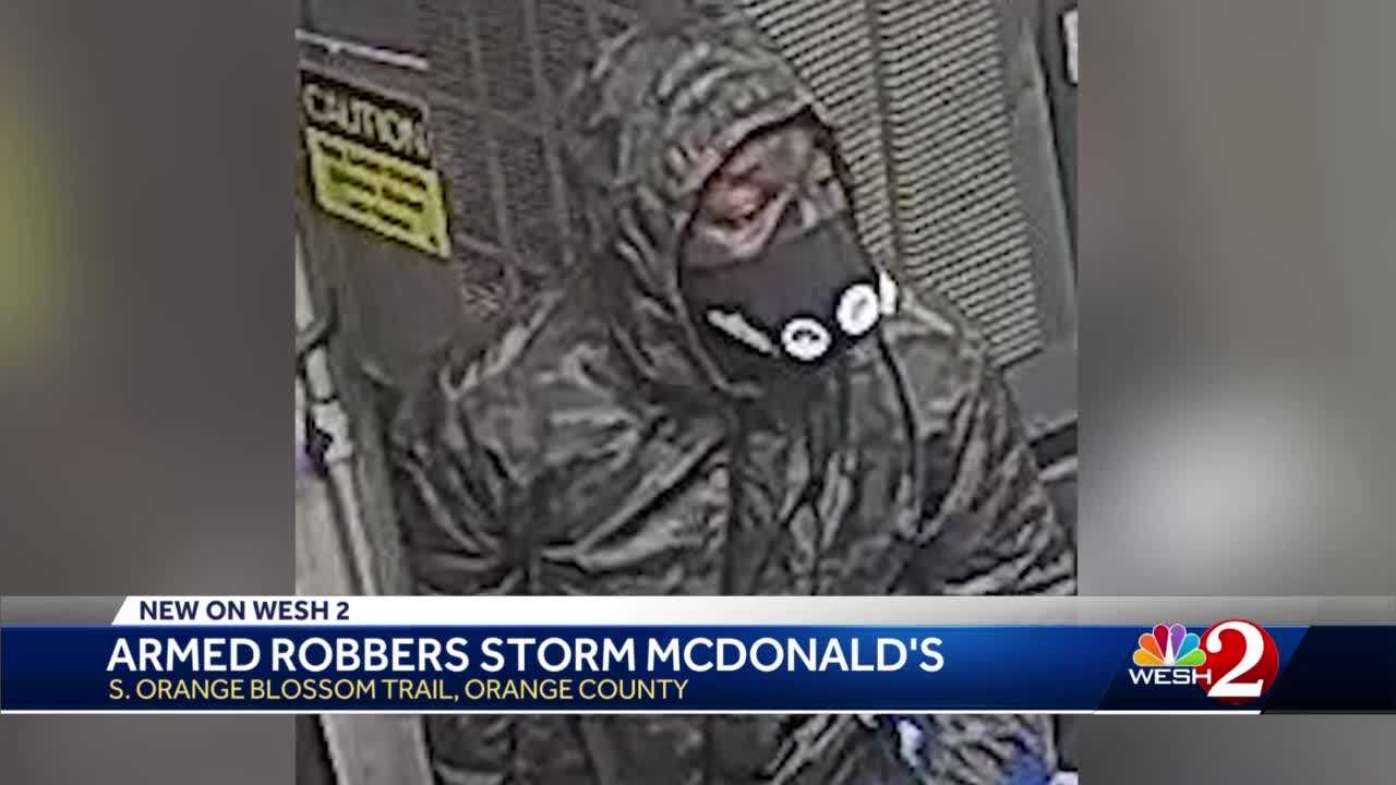 VIDEO: Armed men storm into McDonald's, drag man across floor during ...