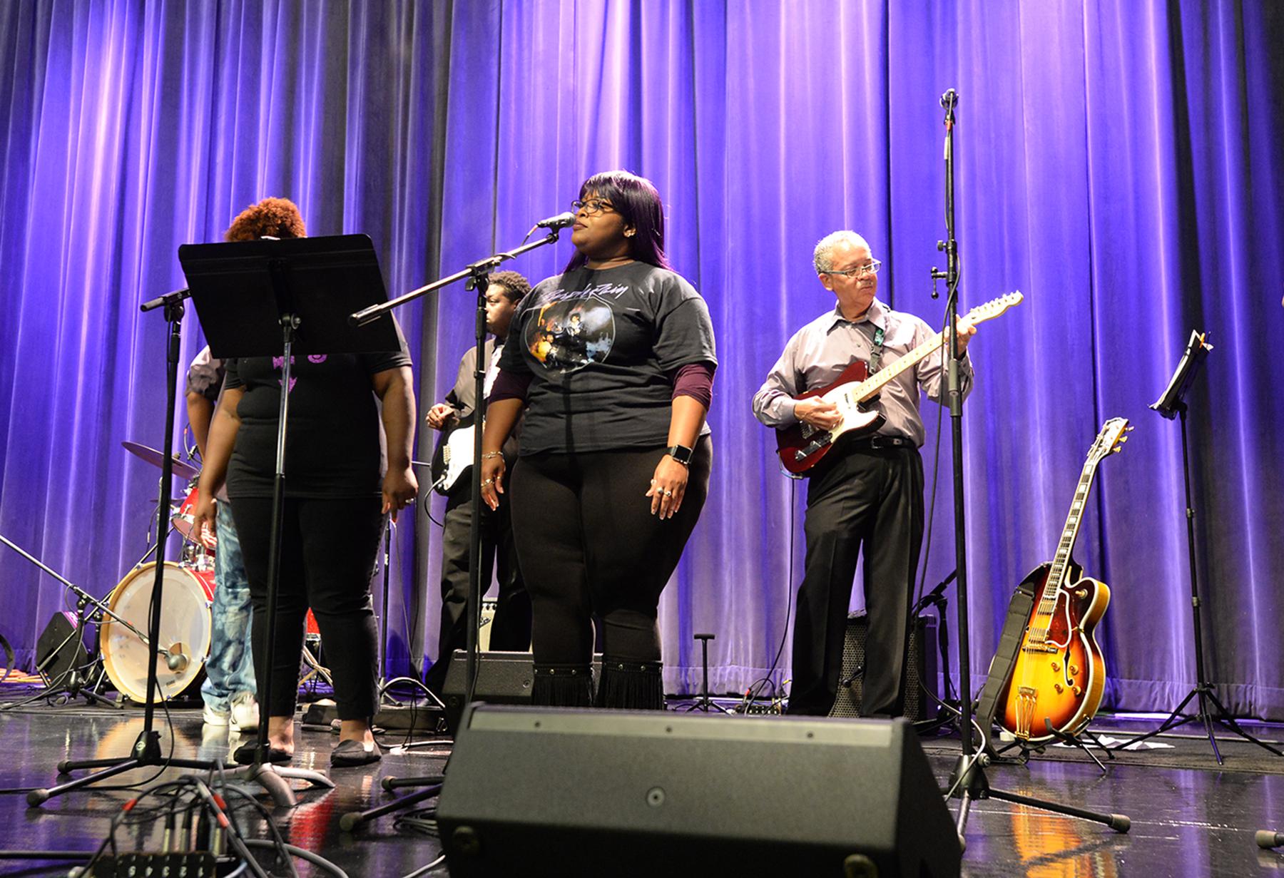 Photos: Flava Band performs Prince tunes downtown