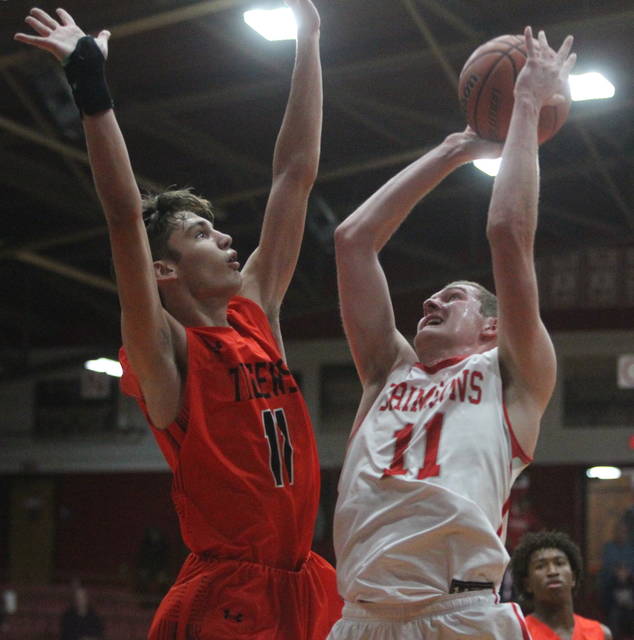 BOYS BASKETBALL: Tigers escape with triple OT win