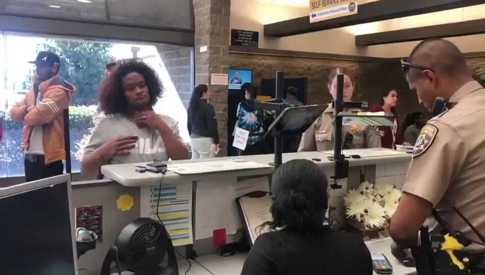 WATCH: Officer helps deaf woman obtain Real ID through sign language ...